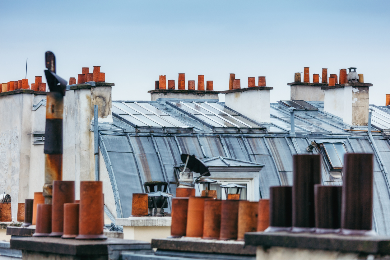 apartment building rooftops chimneys in Paris, France - Ramonage Pro Paris